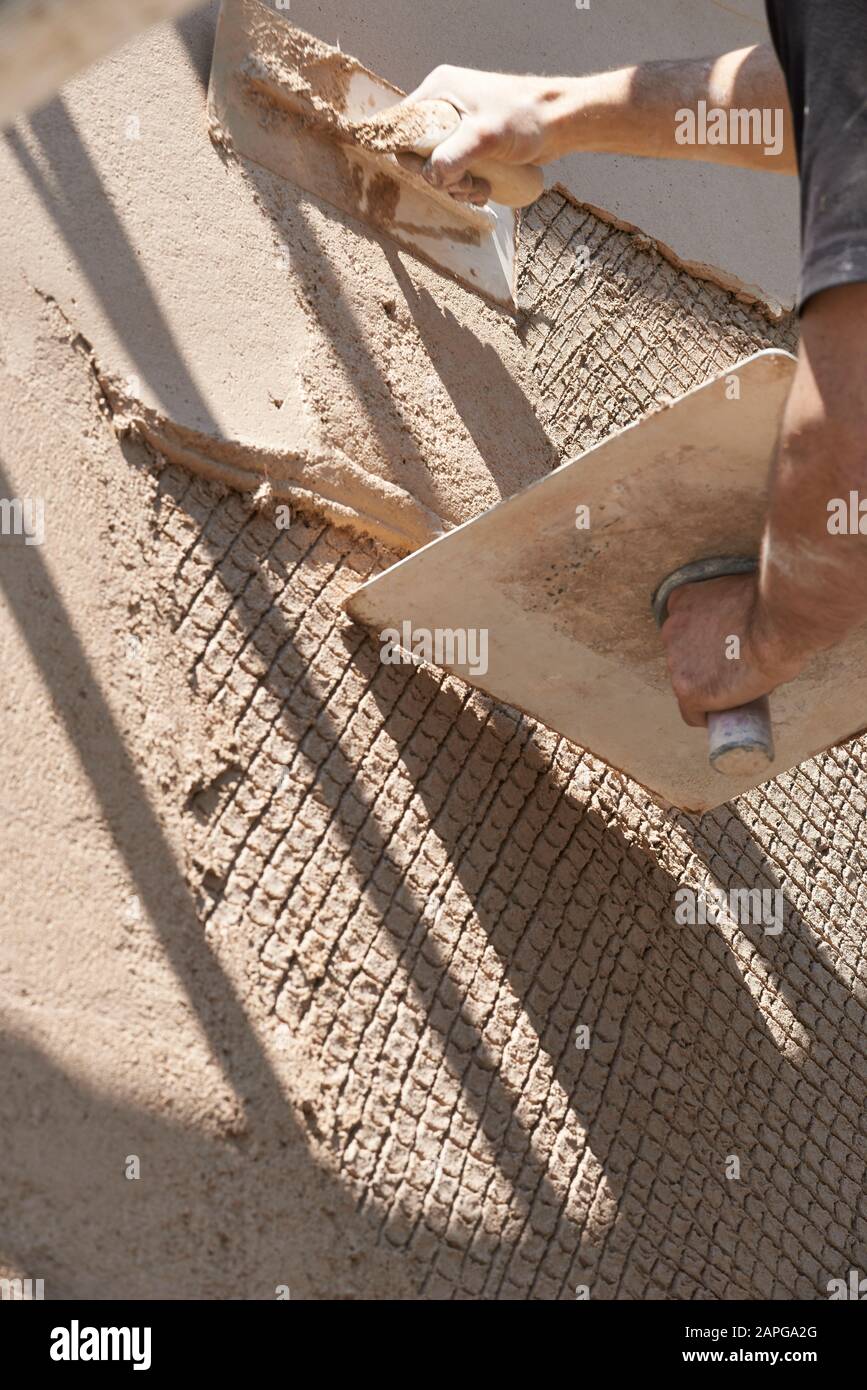 Man using trowel hi-res stock photography and images - Alamy