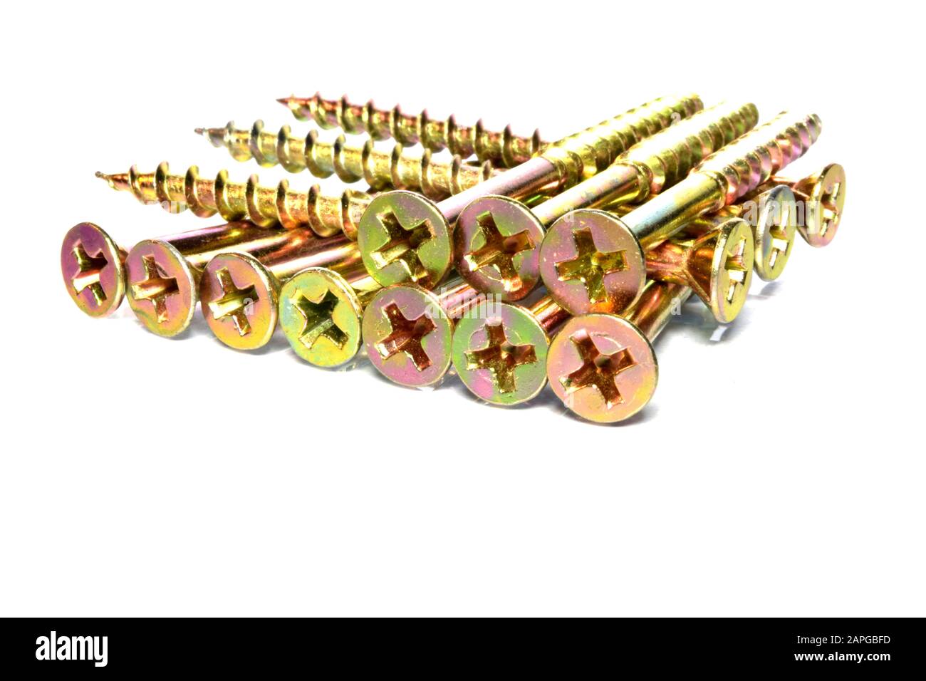 Closeup of colorful screws under the lights against a white background ...