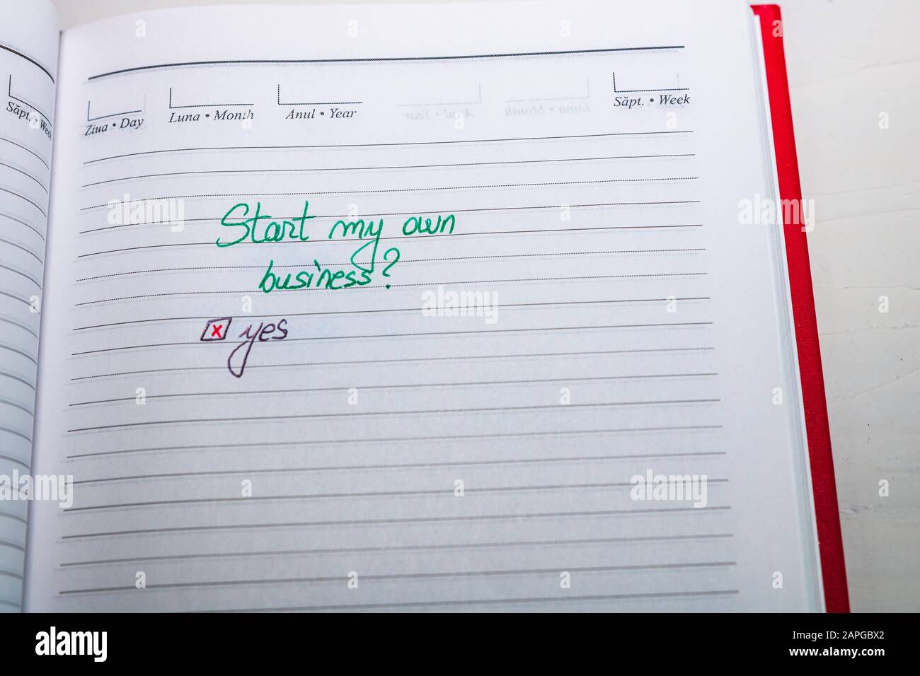 Start my own business and check mark, handwriting text on page of ...