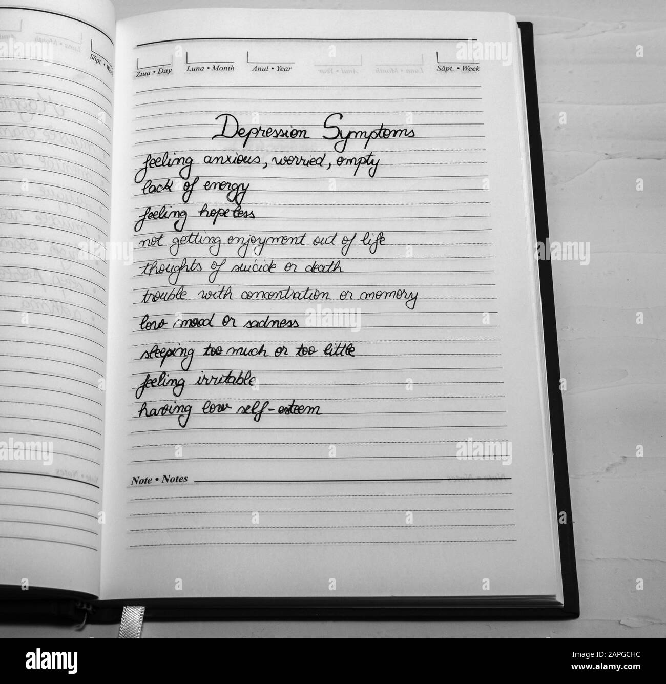 Depression symptoms, handwriting text on page of office agenda. Copy ...