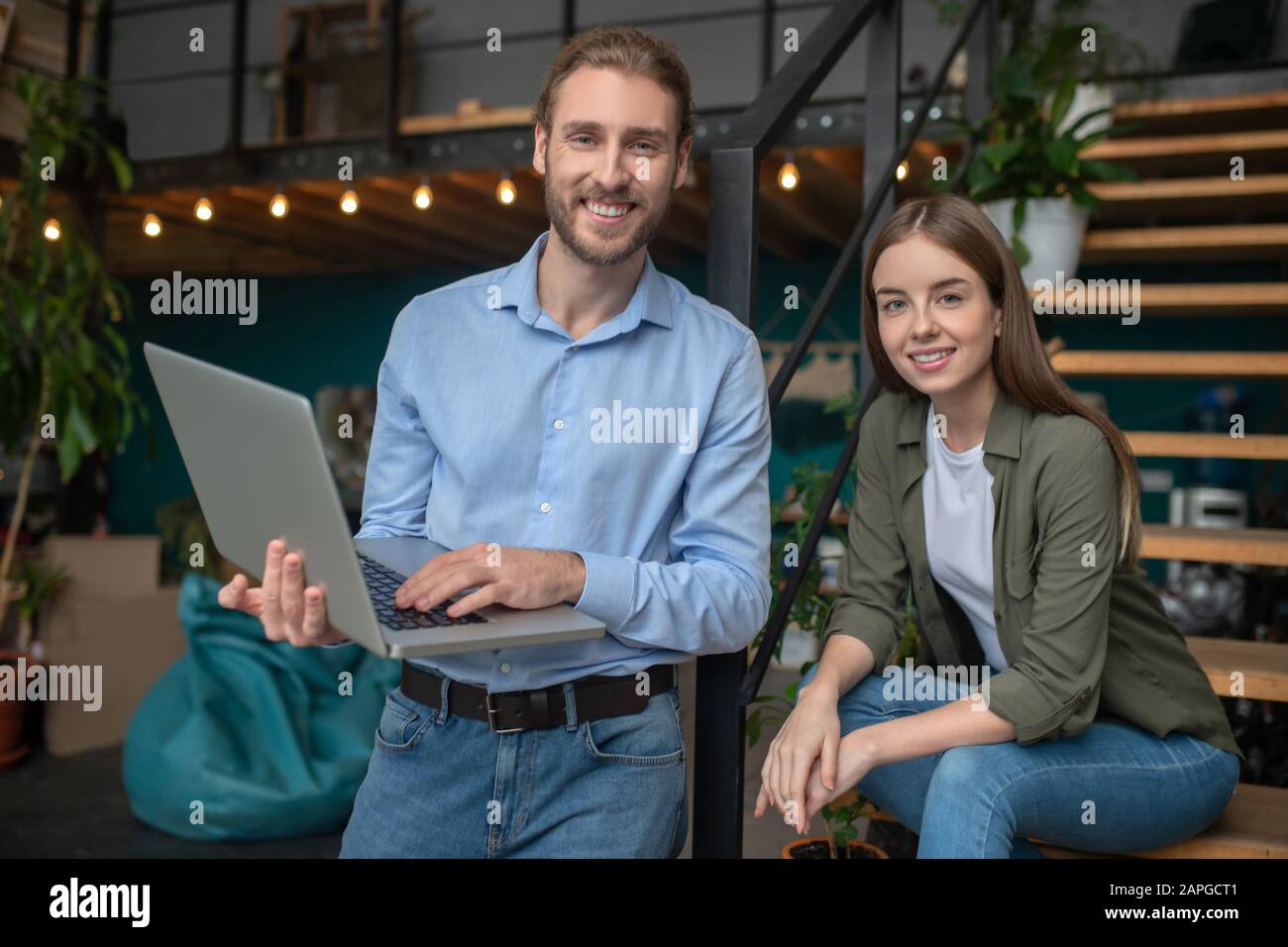 Man and woman doing work tasks together Stock Photo - Alamy