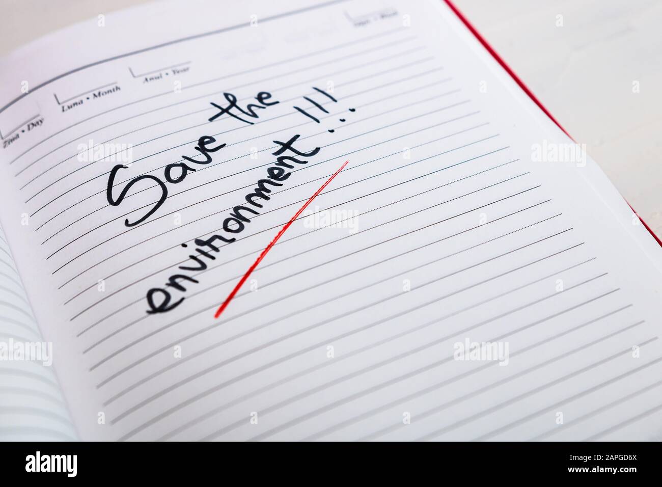 Save the environment, handwriting text on page of office agenda. Copy ...