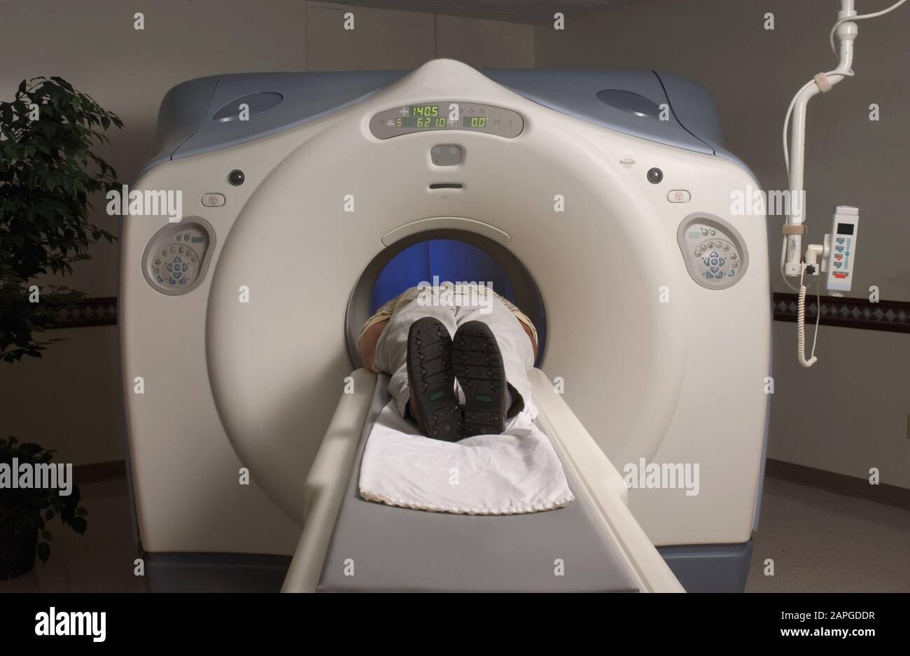 Person lying in an MRI scanner under the lights in a hospital Stock ...