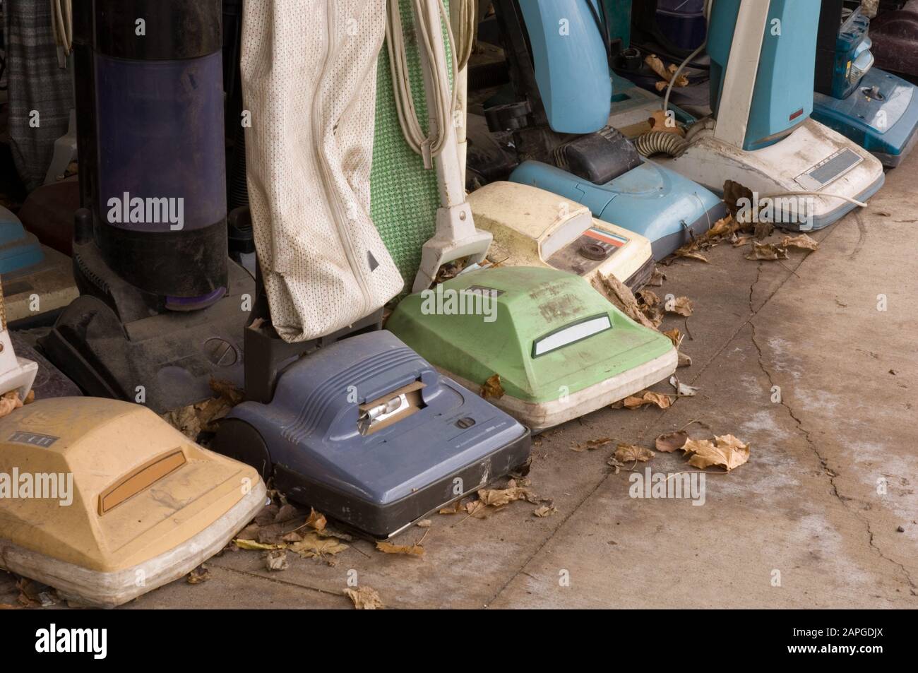 Picture of old dusty and colourful handheld vacuum cleaners surrounded ...