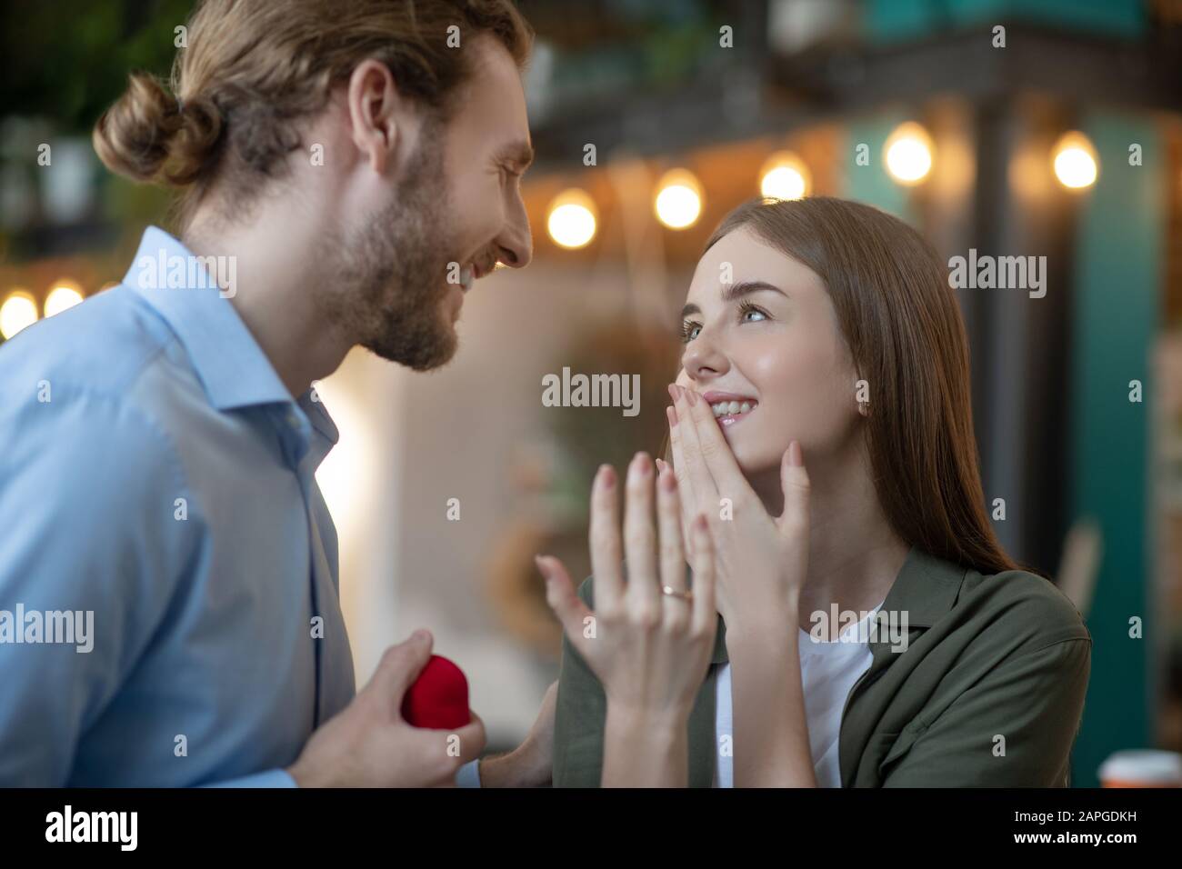 Woman reacting emotionaly to the receiving a proposal Stock Photo - Alamy