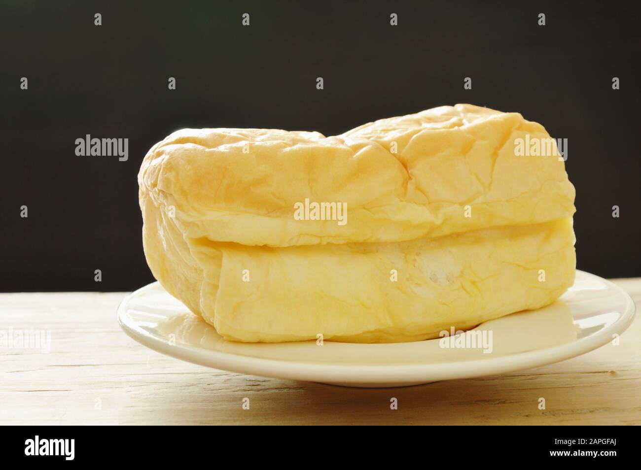 butter bread loaf on plate Stock Photo - Alamy