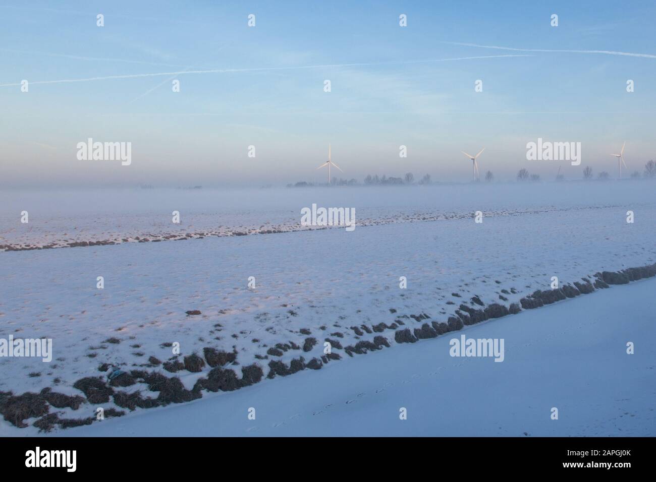 Field under snow with windmill hi-res stock photography and images - Alamy