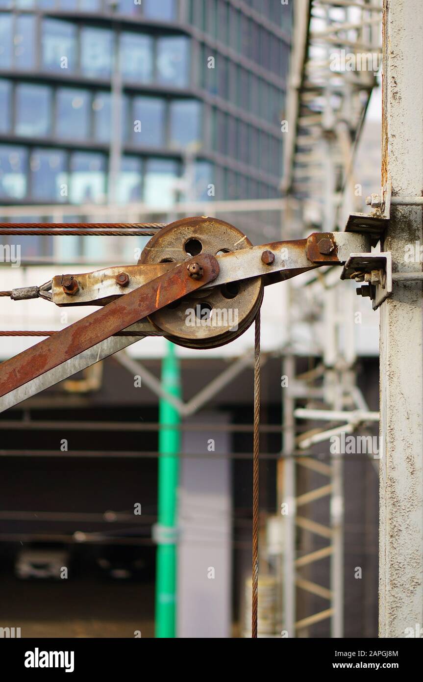 Vertical closeup shot of the mechanism with a rope used for hanging ...