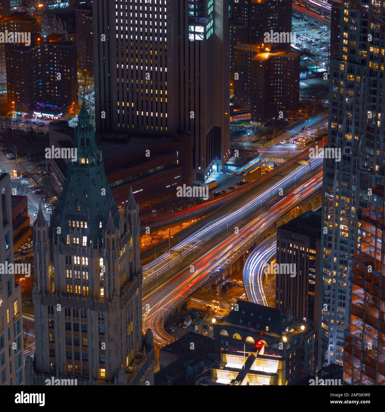 Timelapse shot of a busy street in the middle of city building a night ...