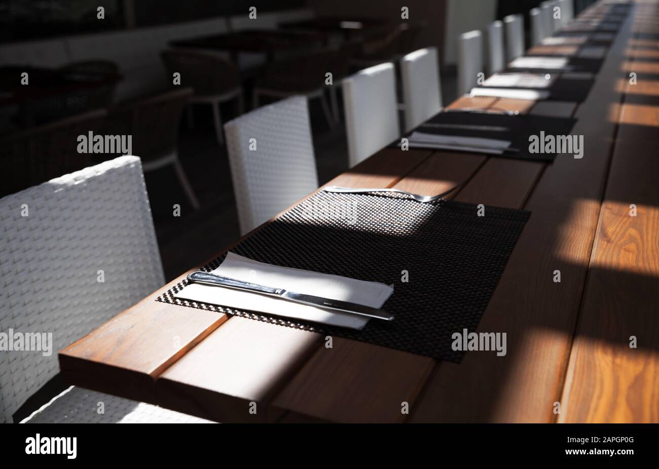 Perspective view of an empty wooden table in a restaurant, photo with ...