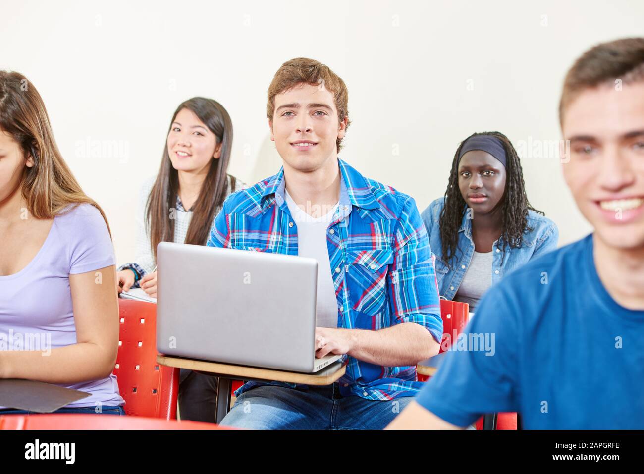 Students learning in class with laptop computer Stock Photo - Alamy