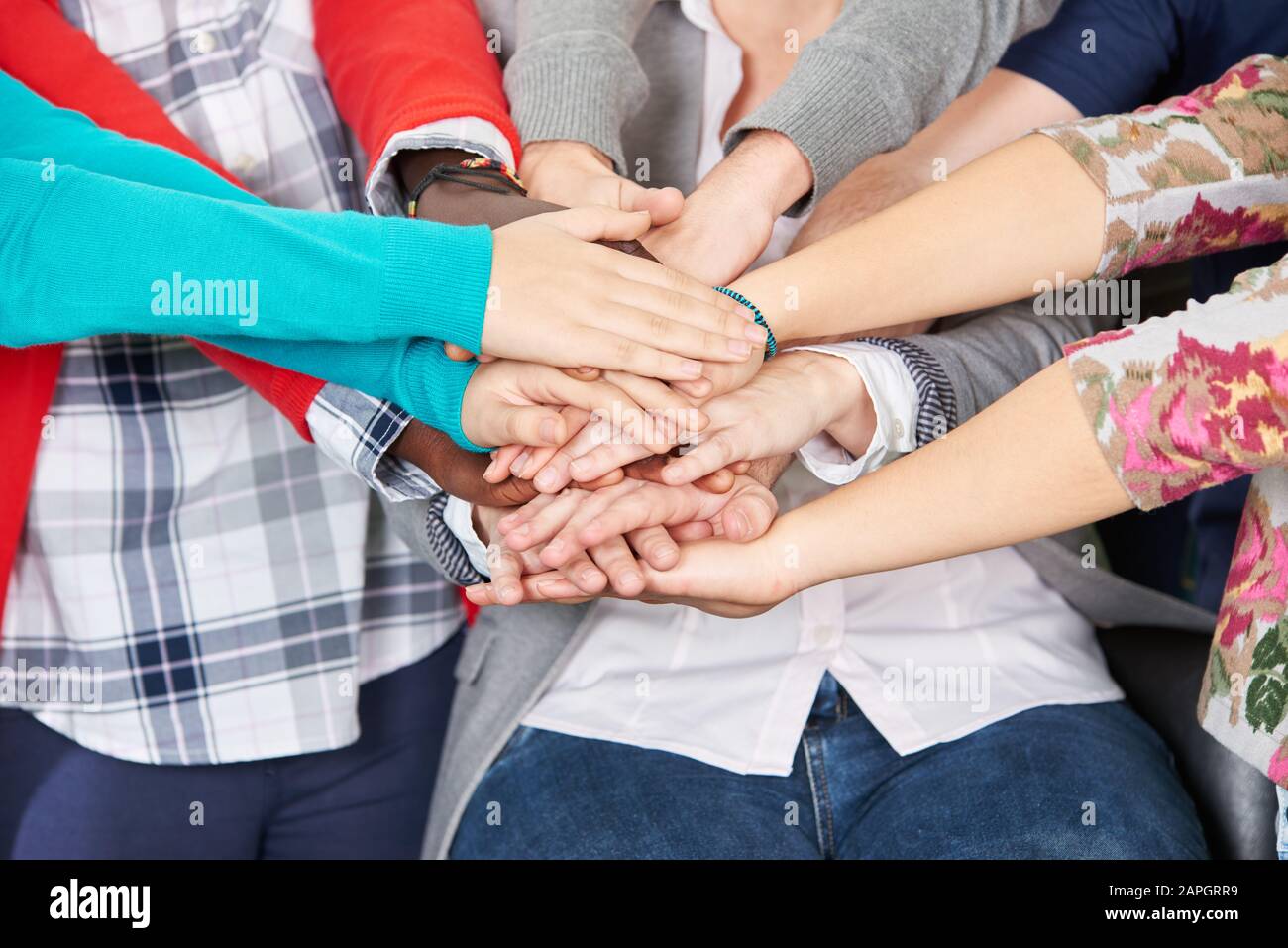 Hands stack group students hi-res stock photography and images - Alamy