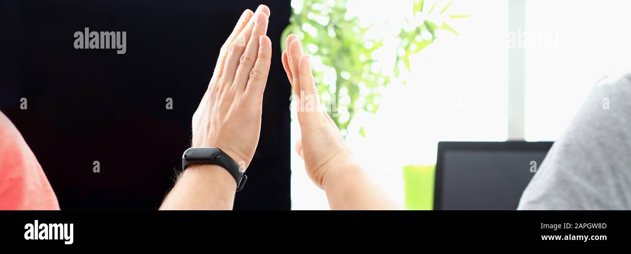 Two male hand in office hive five Stock Photo - Alamy