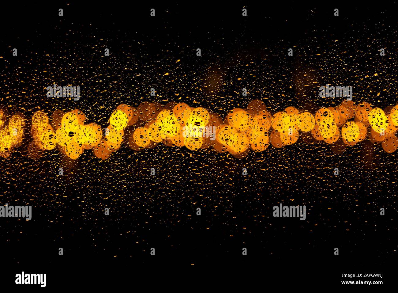 blurry lights and raindrops on window Stock Photo - Alamy