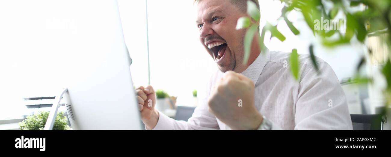 Happy manager at workplace Stock Photo - Alamy