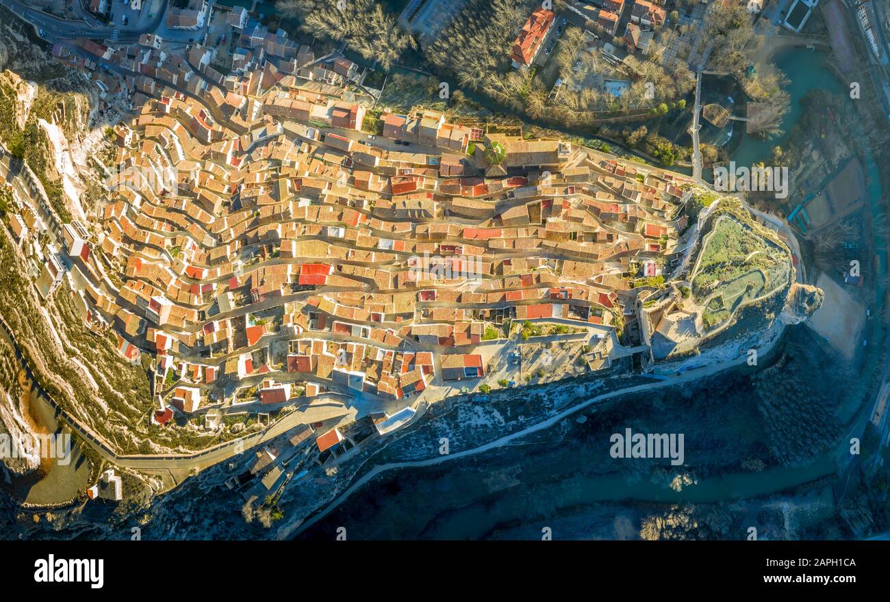 Aerial view of colorful waving, curving rooftops in Alcala del Jucar ...