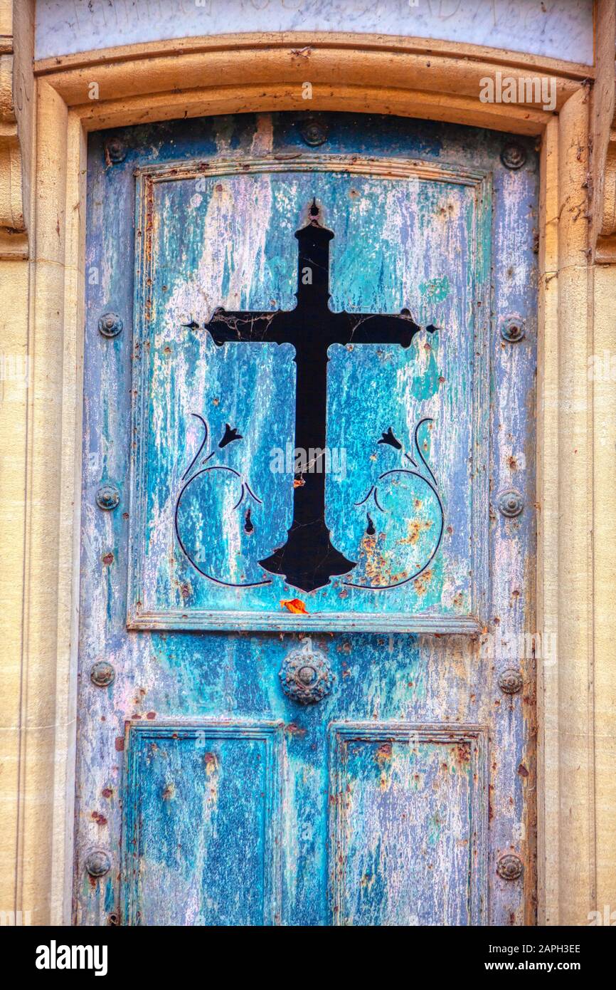 ancient gate with the sign of the cross inlaid Stock Photo - Alamy