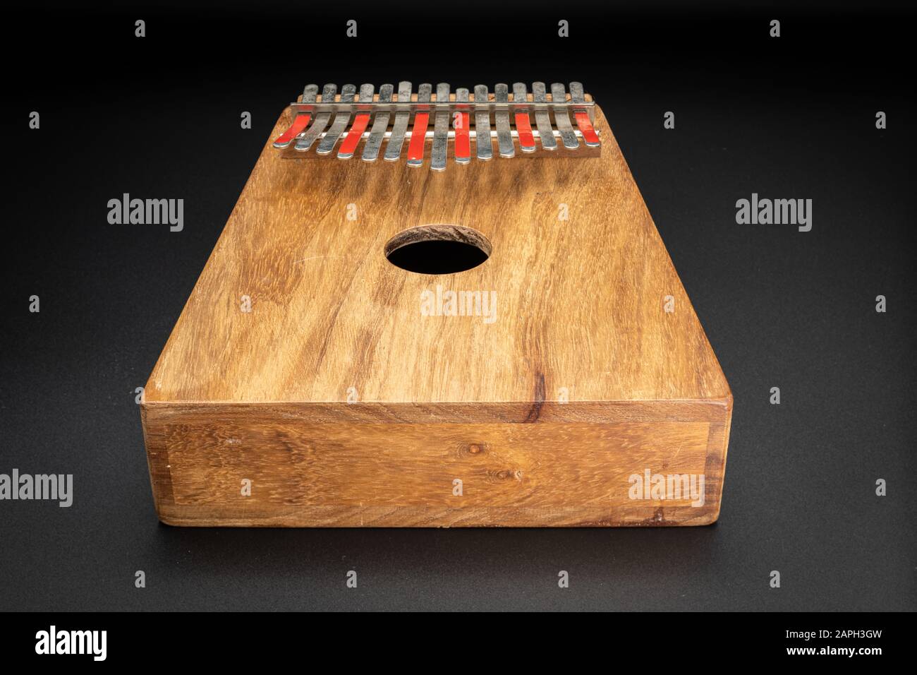 Details of a thumb piano (Kalimba, Mbira) with silver and red tines ...