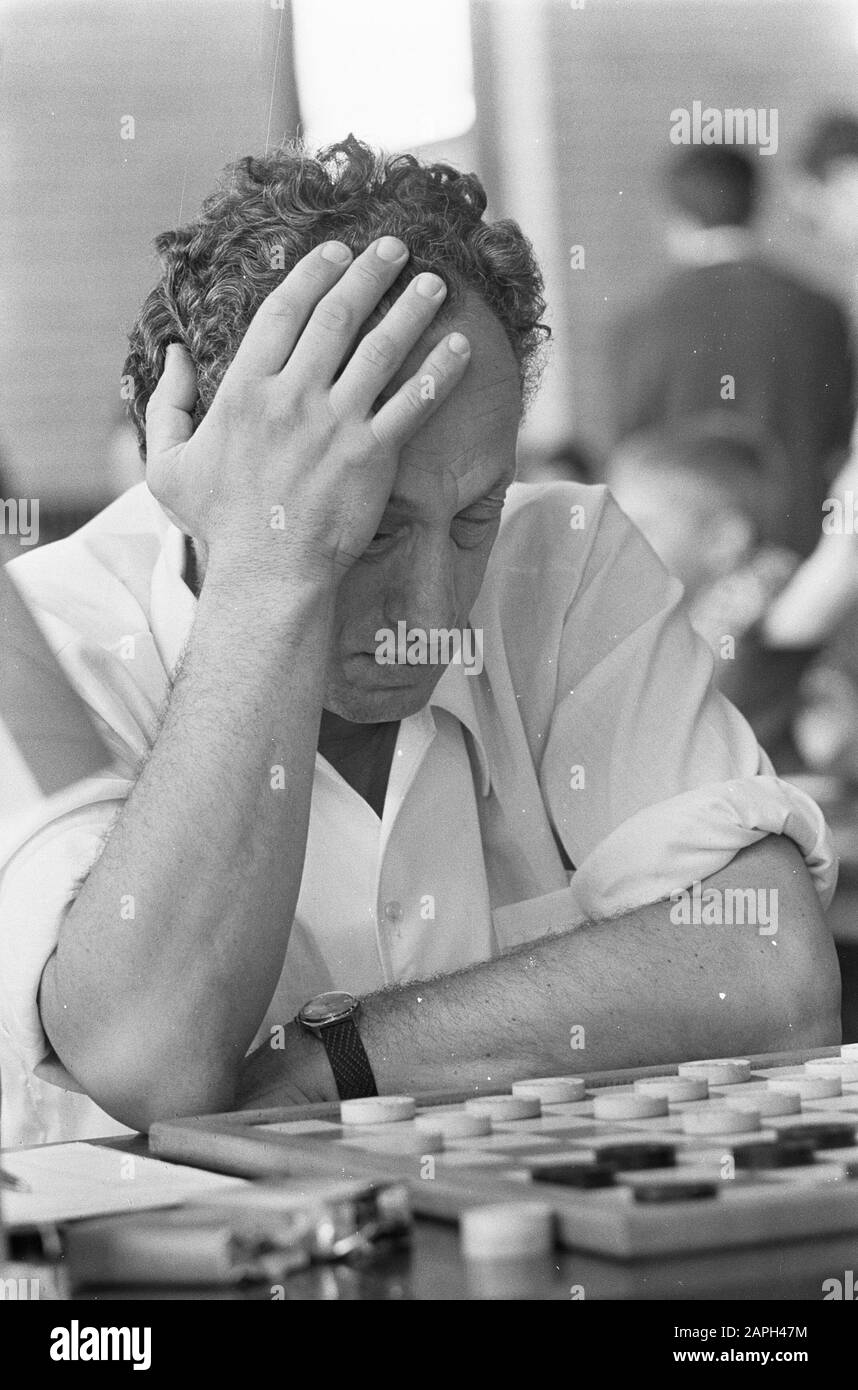 Checkers Netherlands versus Russia. The Russian Kuperman to the board ...