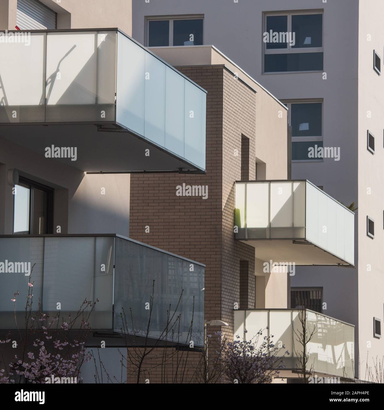Modern concrete balcony s in a cut out on blue sky Stock Photo - Alamy
