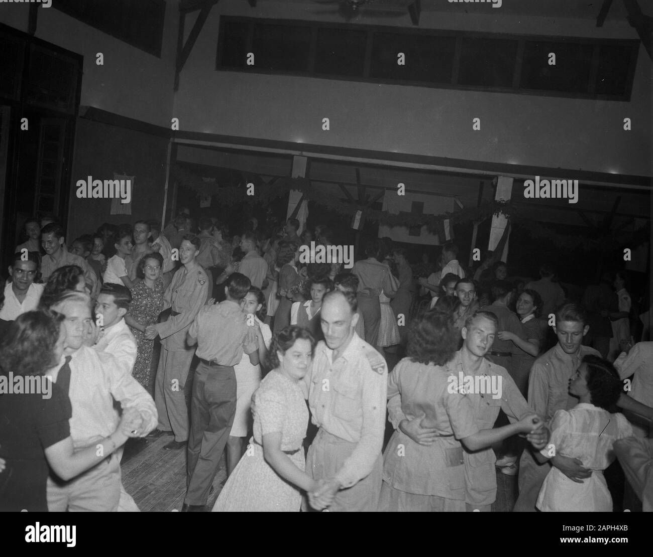 Party Eve Red Cross Description: [Dancing couples in banquet hall] Date ...