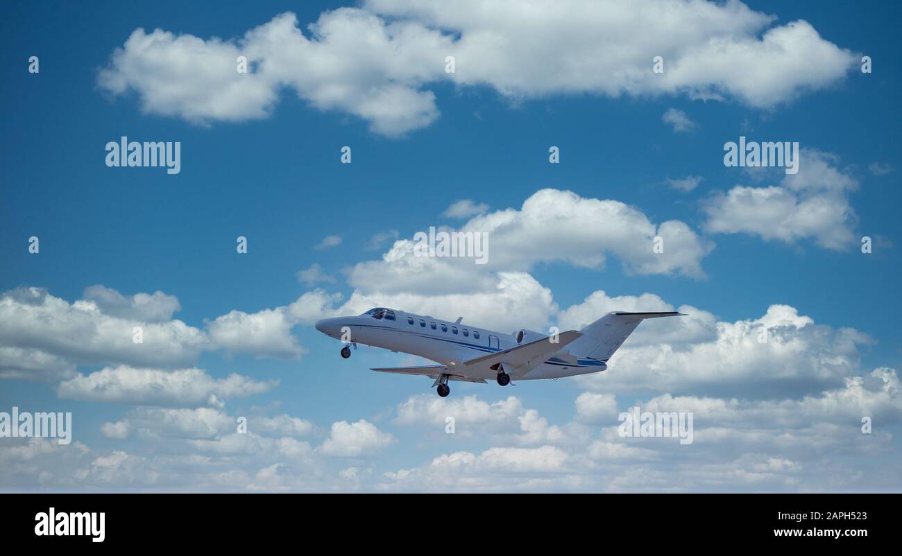White Jet Rising in Clouds Stock Photo - Alamy