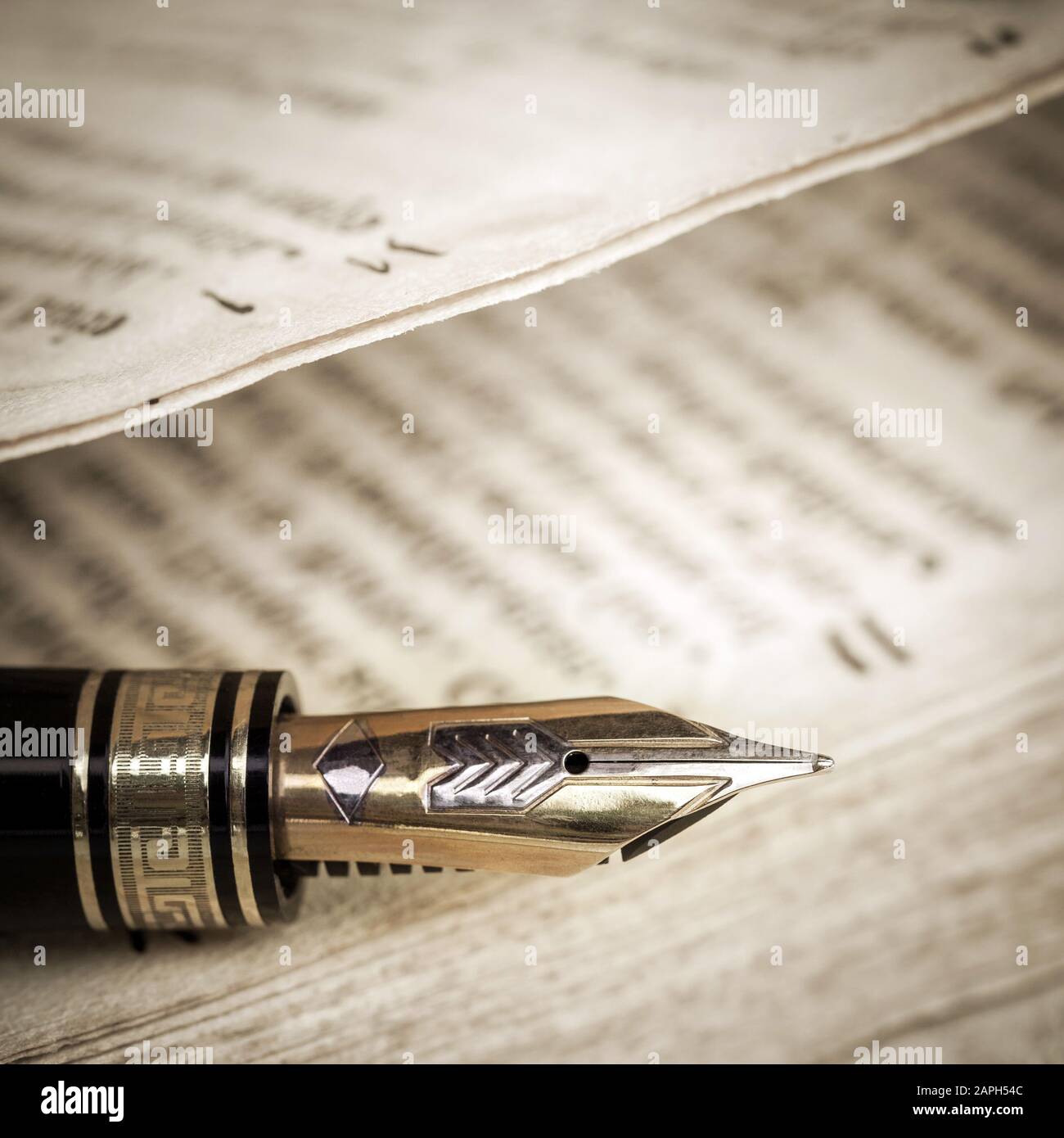 fountain pen on old book Stock Photo - Alamy