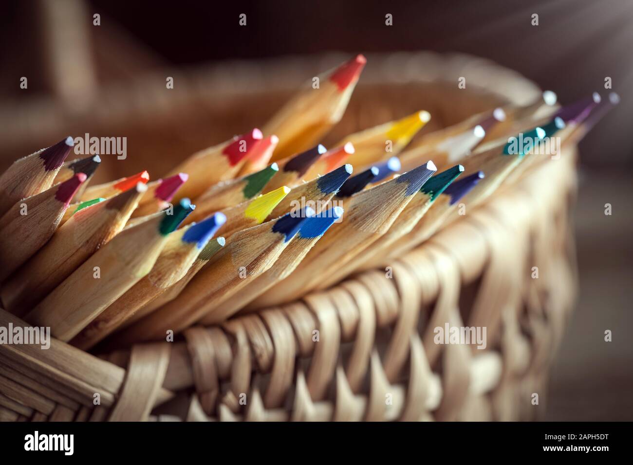 colored wooden pencils in basket Stock Photo - Alamy