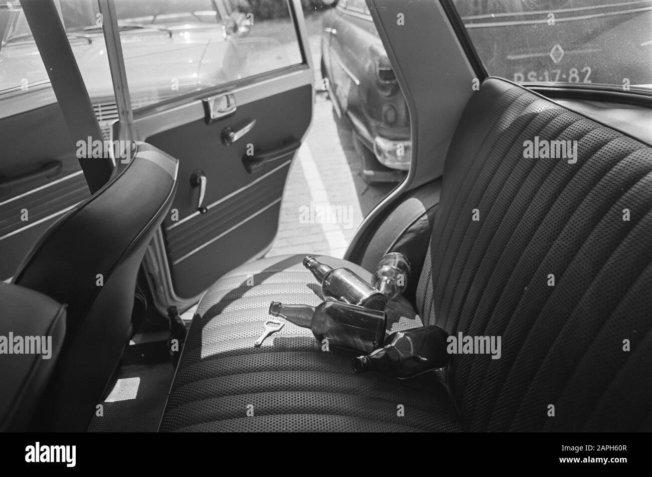 Car left after joyriding Description: The rear seat with empty beer ...