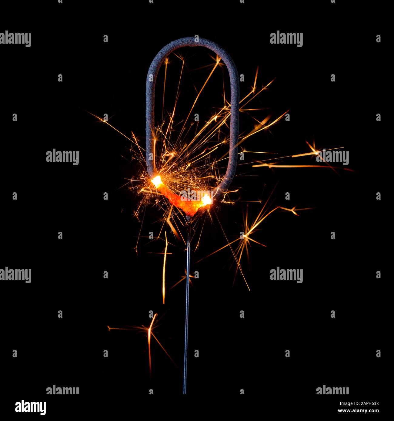 Burning sparkler in shape of number zero, digit 0, isolated on black ...