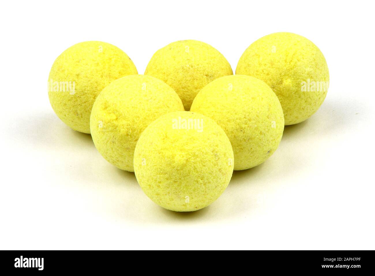 Close up view of yellow boilies, fishing baits for carp isolated on ...