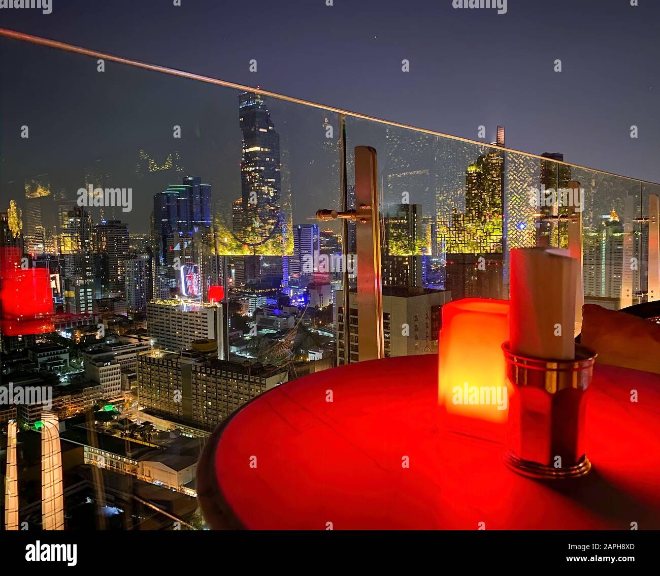 Rooftop at night with amazing city view. Holiday, travel and relax ...