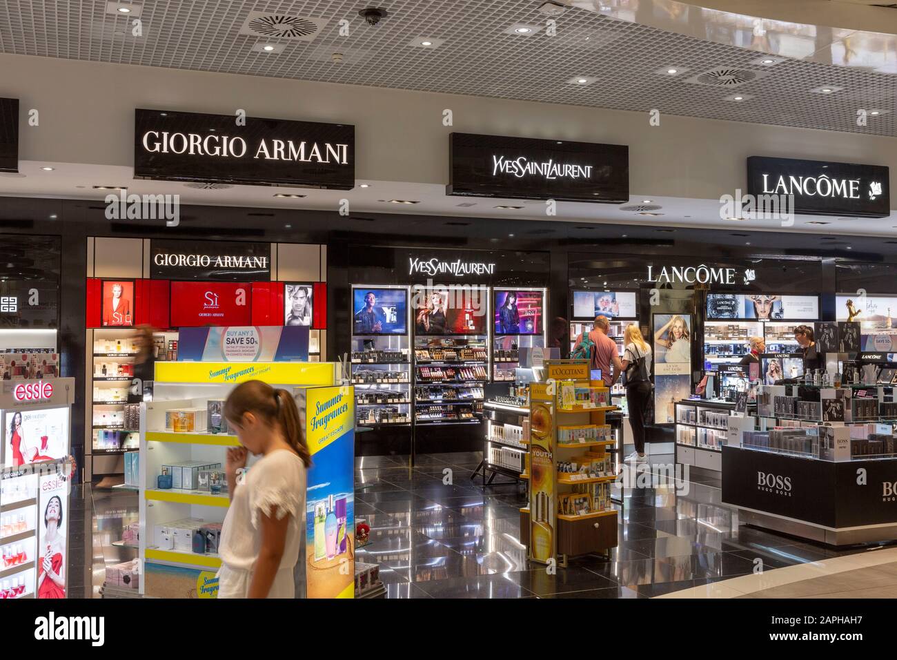 Shoppers in the cosmetics duty free section at Malaga Airport in Spain ...