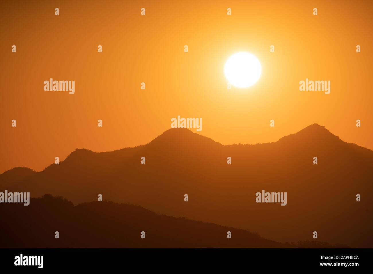 Sun during Sunset ,sunrise background with mountain Stock Photo - Alamy