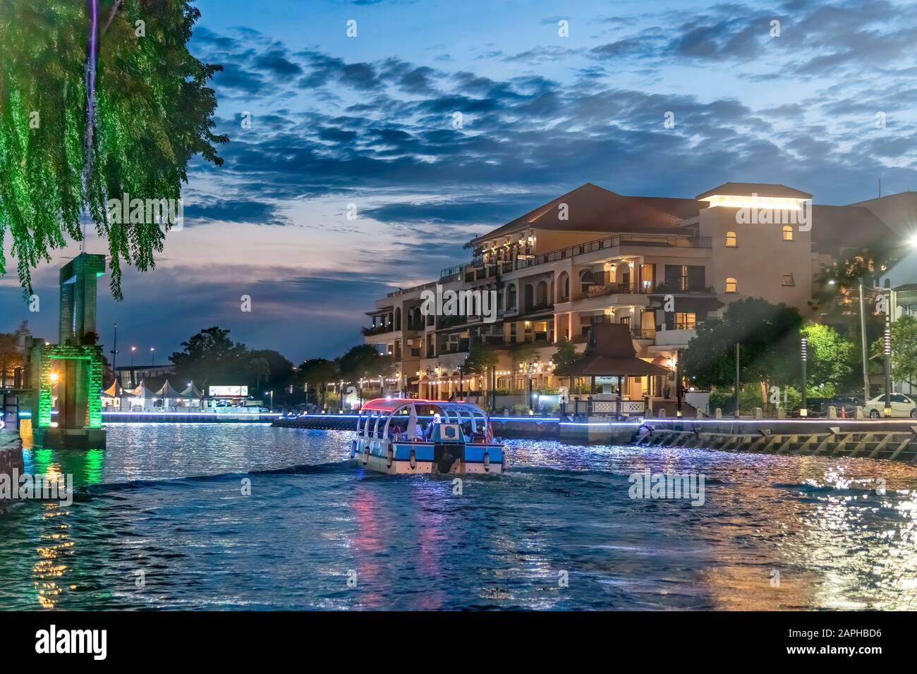 Sunset view of Melaka riverfront from a cruise boat. Malacca River and ...