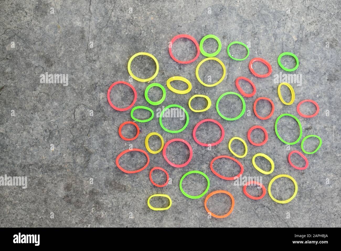 Colorful rubber bands. Rubber bands in black background. Vibrant ...