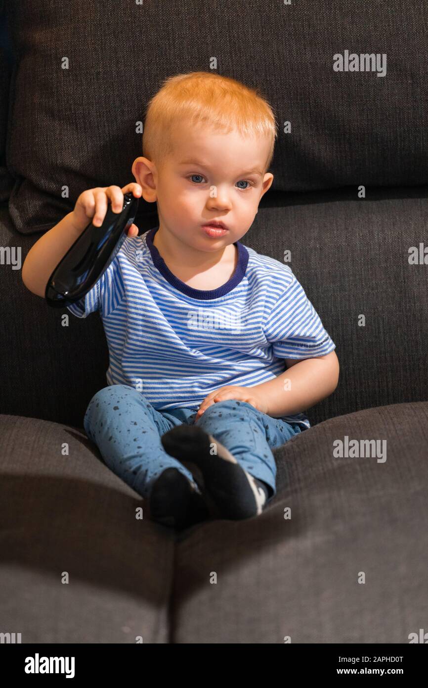Little boy watching tv Stock Photo - Alamy