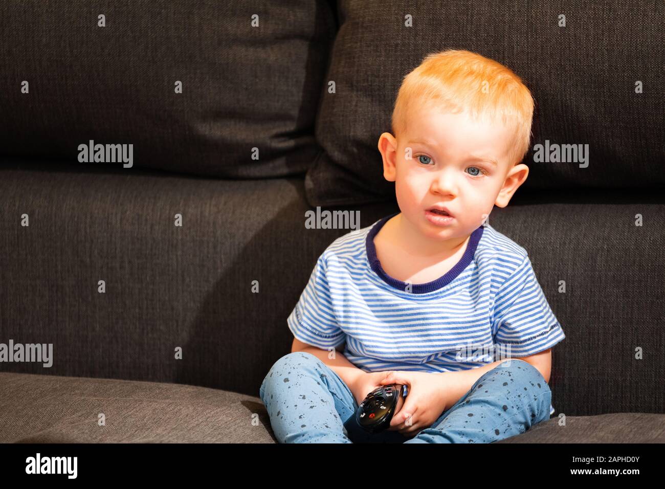 Little boy watching tv Stock Photo - Alamy