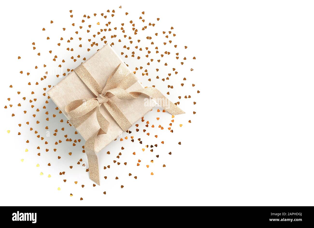 Beautiful present box with elegant golden bow on white background with ...