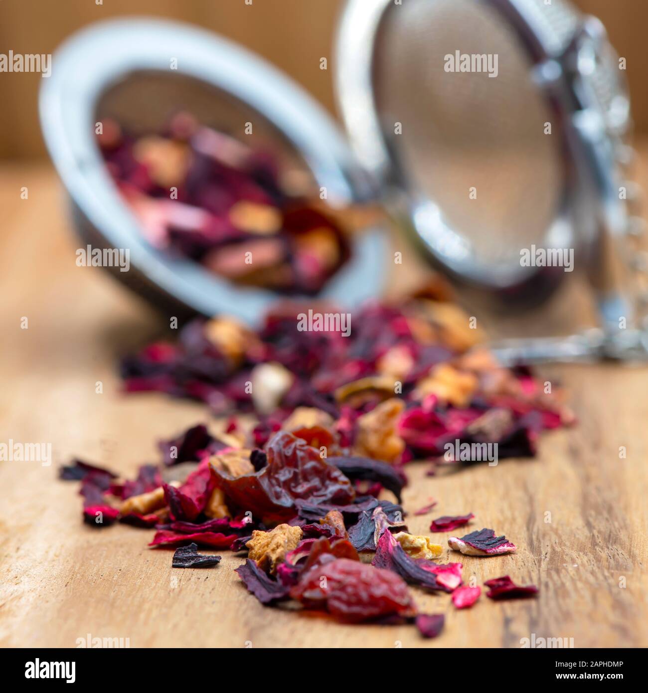 square fruit infused red berry tea with orange and apple peel , wooden ...