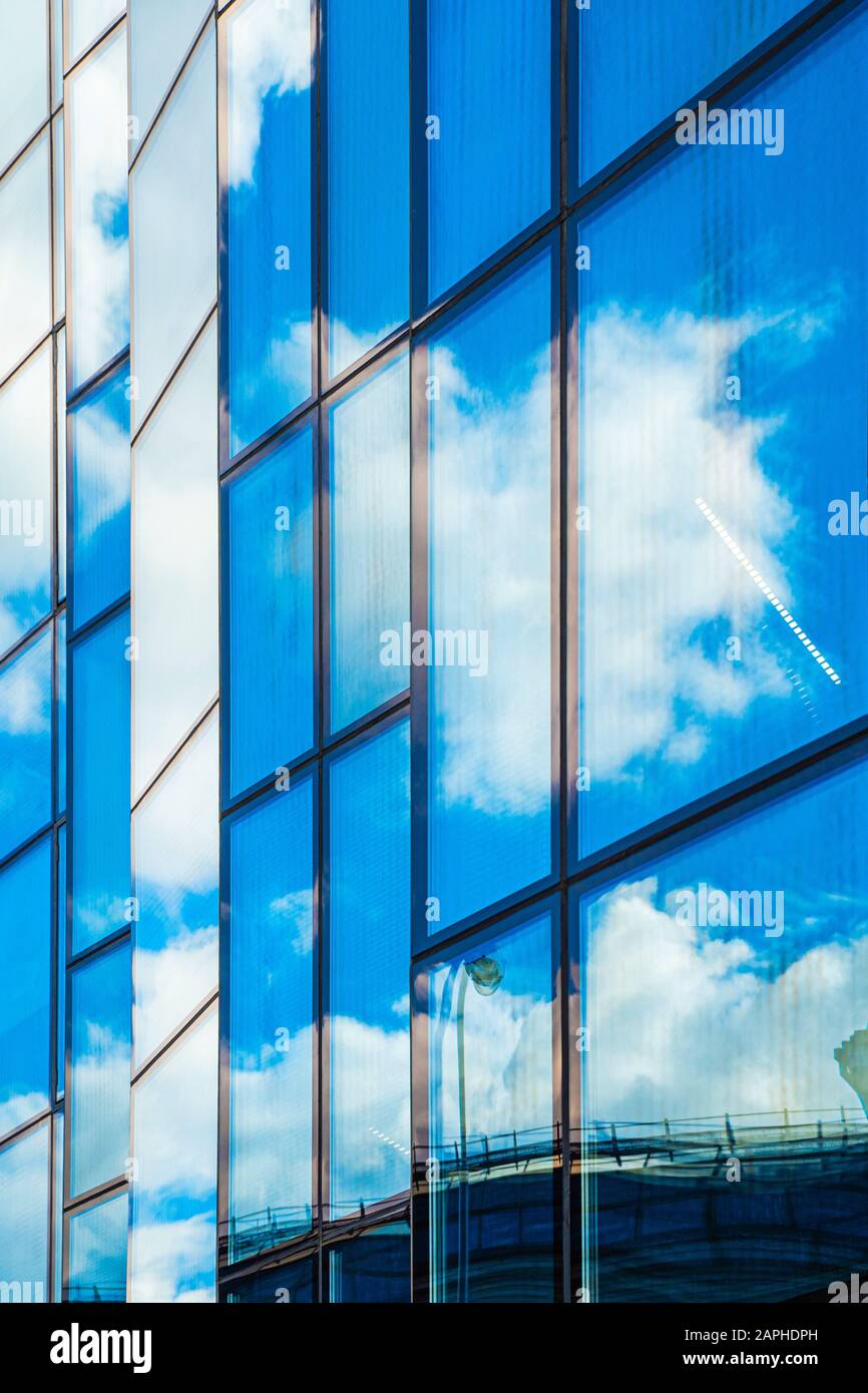 Reflections of the sky in the glass facade of the building Stock Photo ...