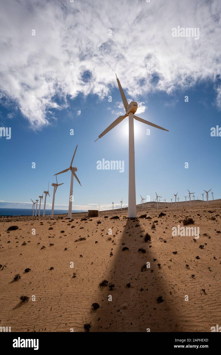 wind turbine in the desert with blue sky background. wind mill farm in ...