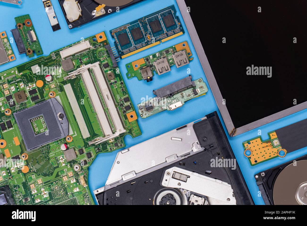 Parts of a modern computer. The insides of a laptop on a blue ...