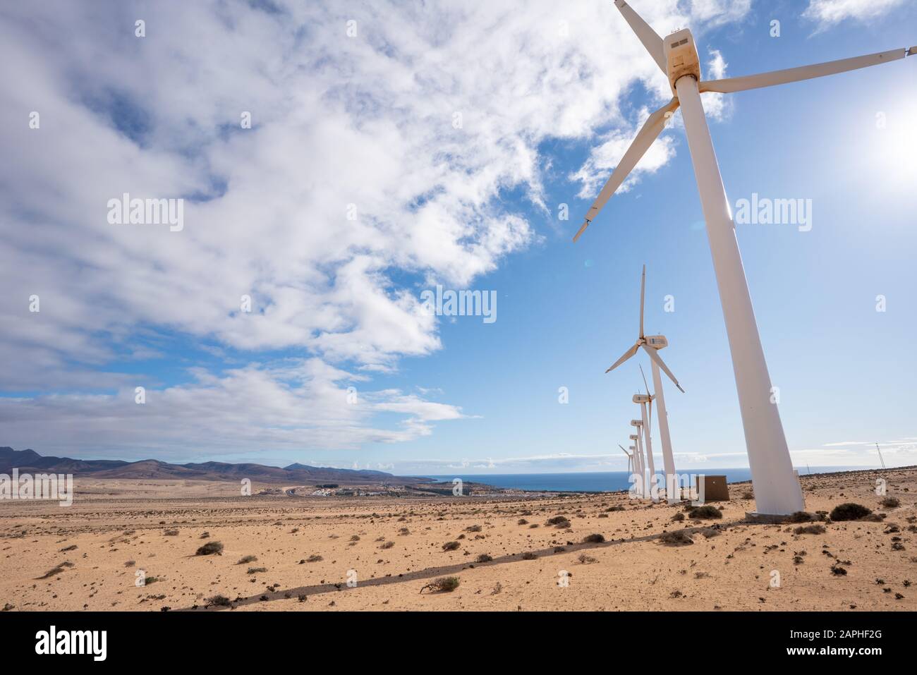 wind turbine in the desert with blue sky background. wind mill farm in ...