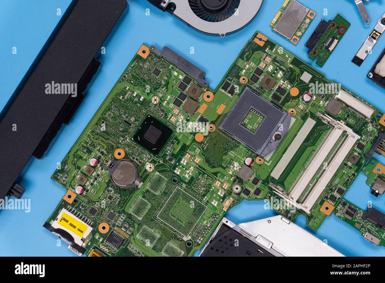 Parts of a modern computer. The insides of a laptop on a blue ...