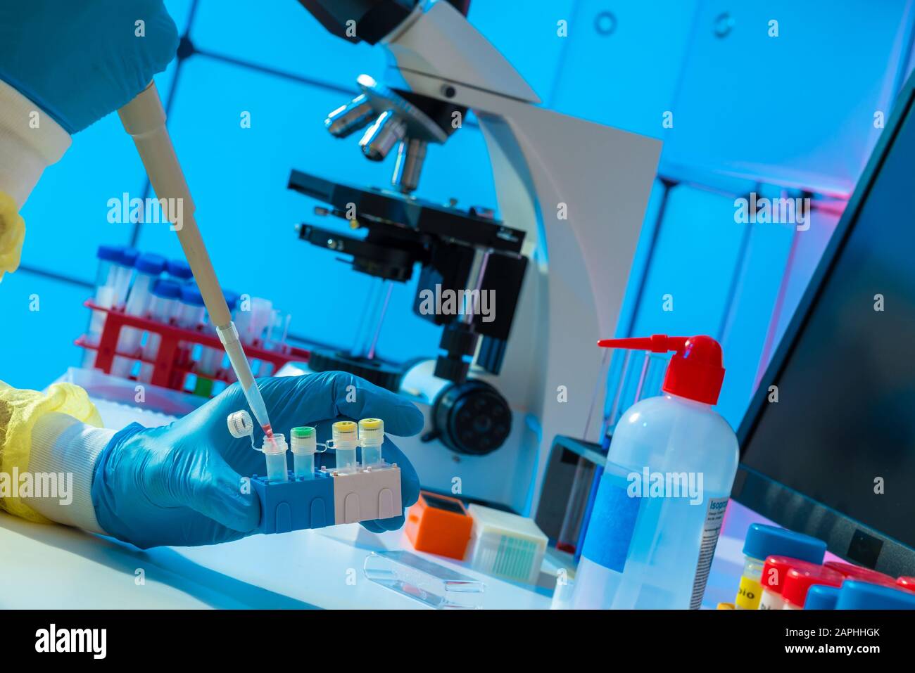 Scientific experiment in microbiological lab. Microscope and test tube ...