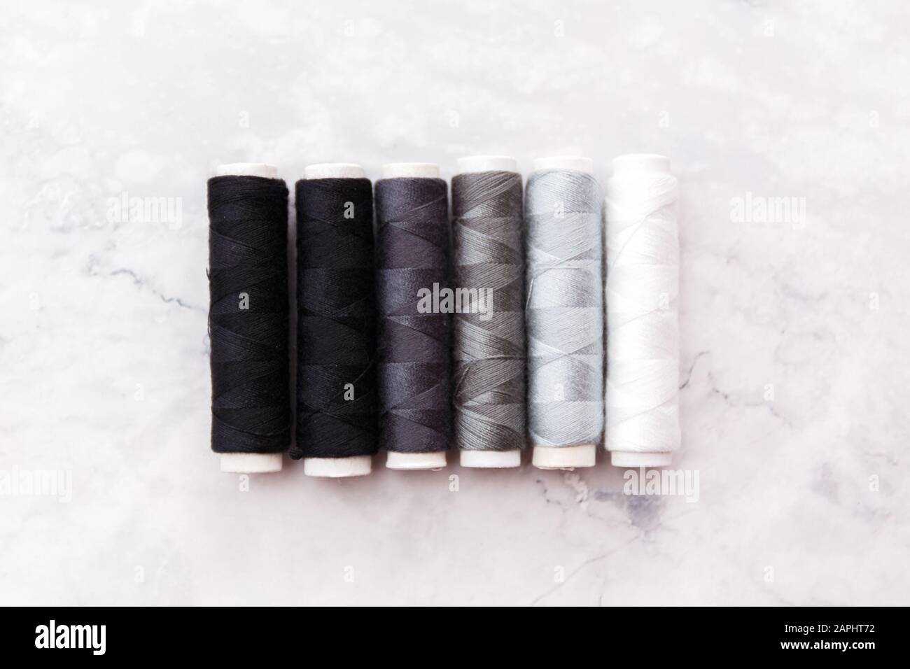 colorful sewing and tailoring tools and items on light background Stock ...