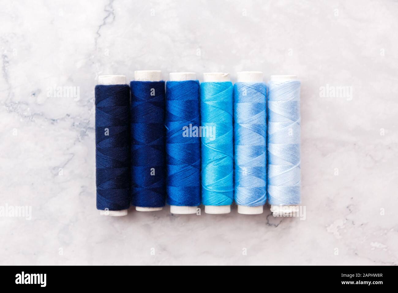 colorful sewing and tailoring tools and items on light background Stock ...