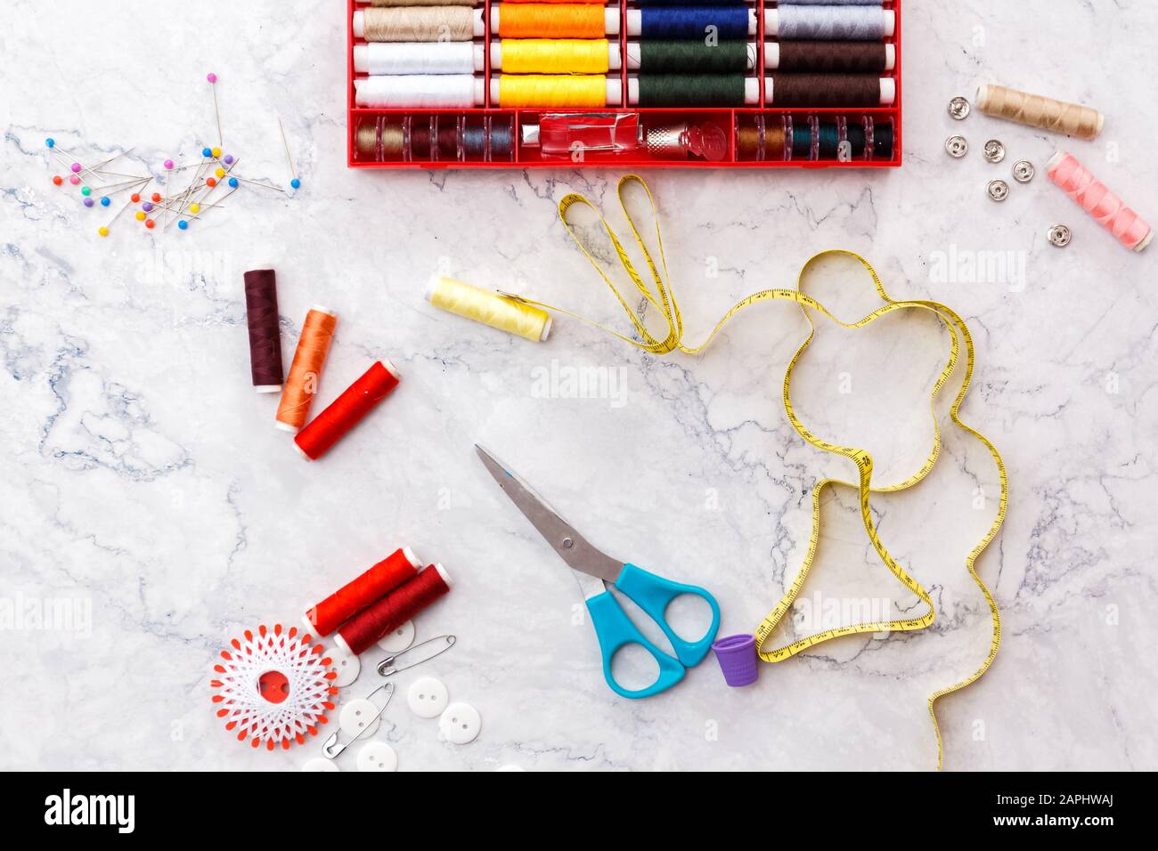 colorful sewing and tailoring tools and items on light background Stock ...