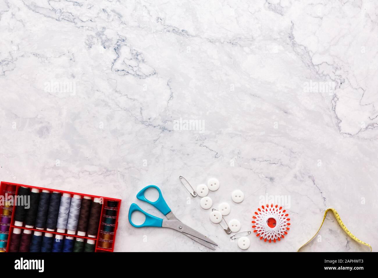 colorful sewing and tailoring tools and items on light background Stock ...